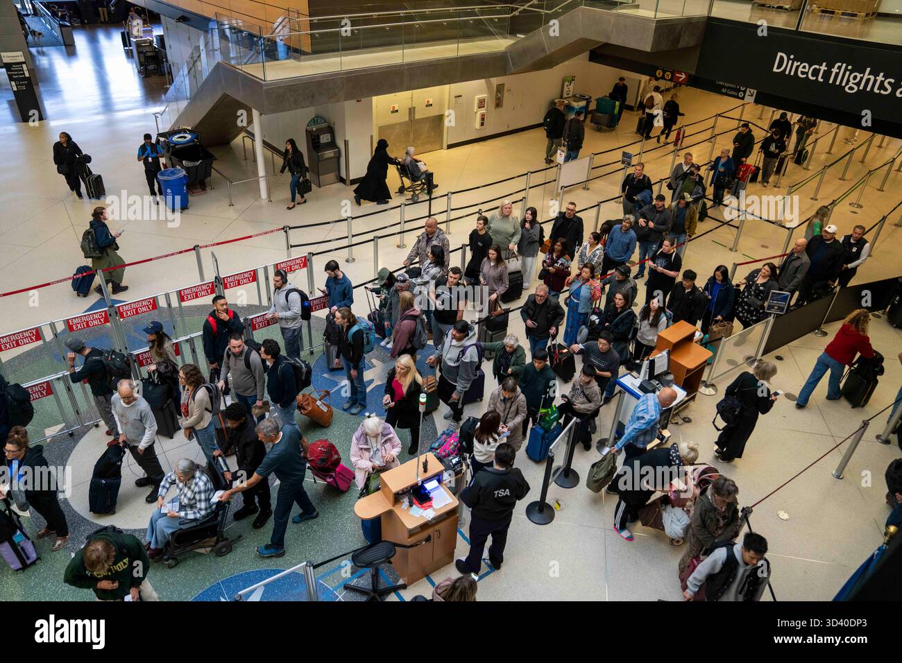 Seatac, Washington, USA. 7th Nov, 2025. People wait in line at a ...