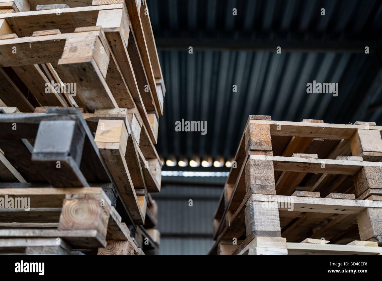 Pile of used euro pallets in distribution depot illustrating wood ...