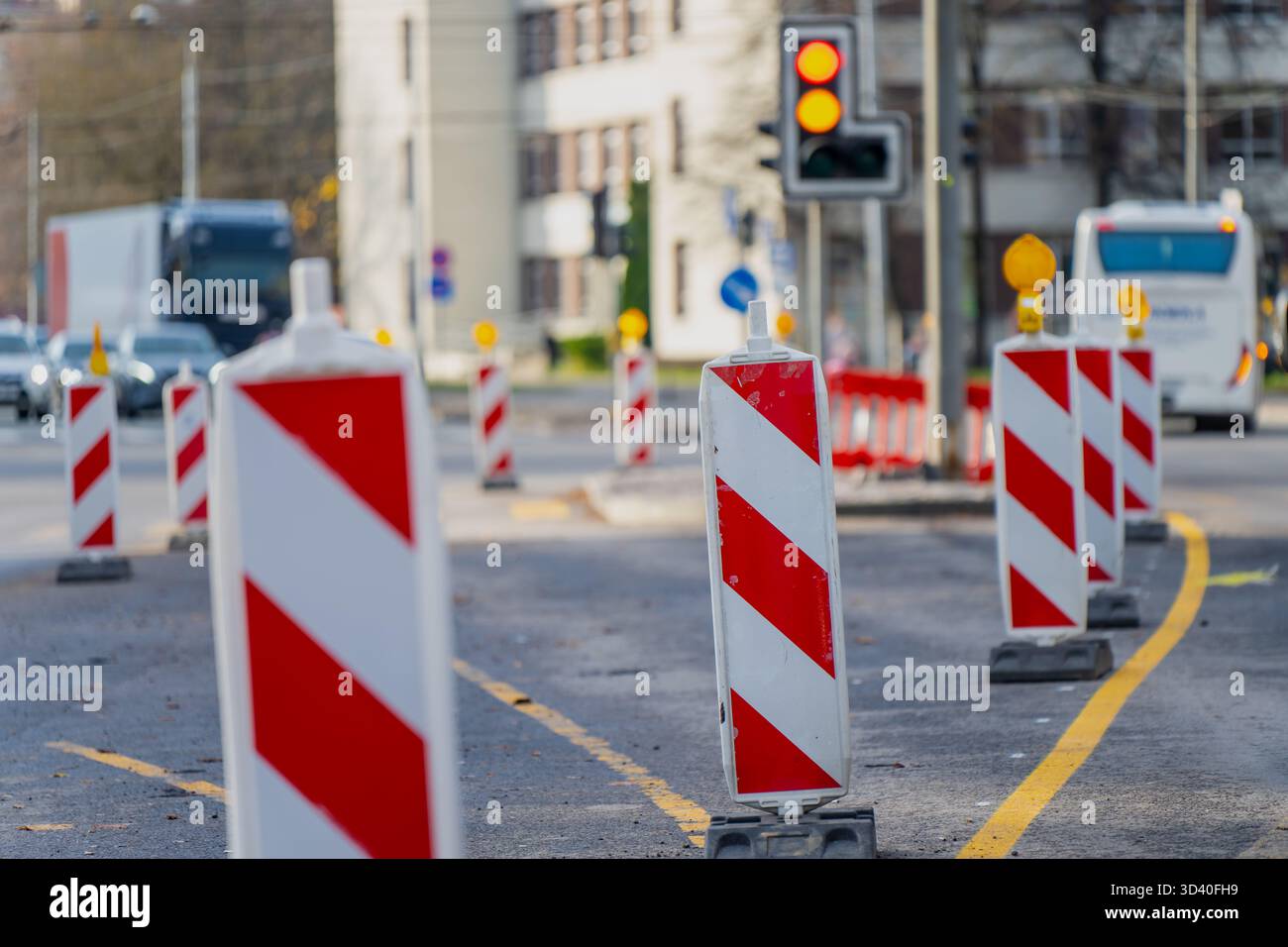 Riga city road under repair with temporary barriers, yellow lane ...
