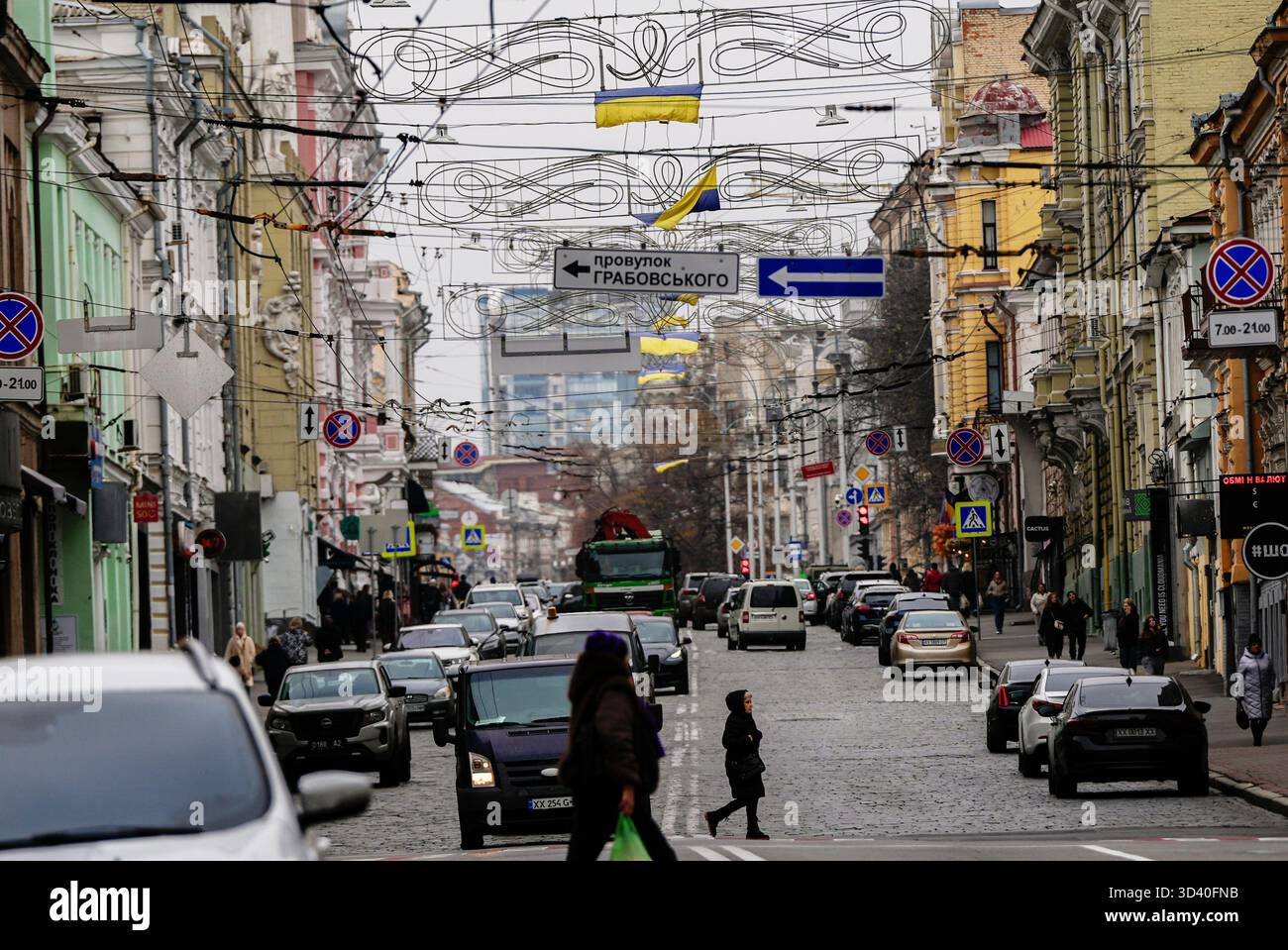 People cross Sumska Street, Friday, Nov. 7, 2025, in Kharkiv, Ukraine ...