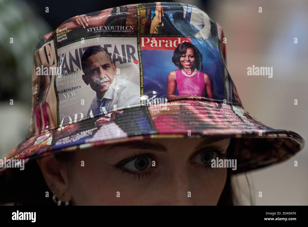 Riley Judd, 24, of Washington, wears a hat with photographs of former ...