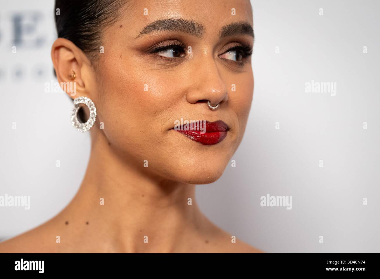 Nathalie Emmanuel poses for photographers upon arrival at the Harper's ...