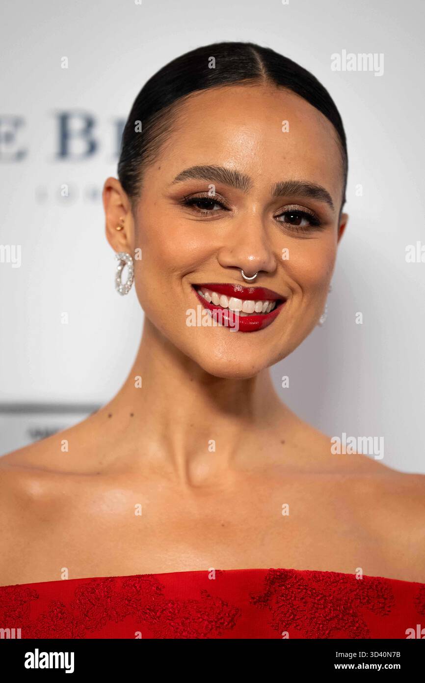 Nathalie Emmanuel poses for photographers upon arrival at the Harper's ...