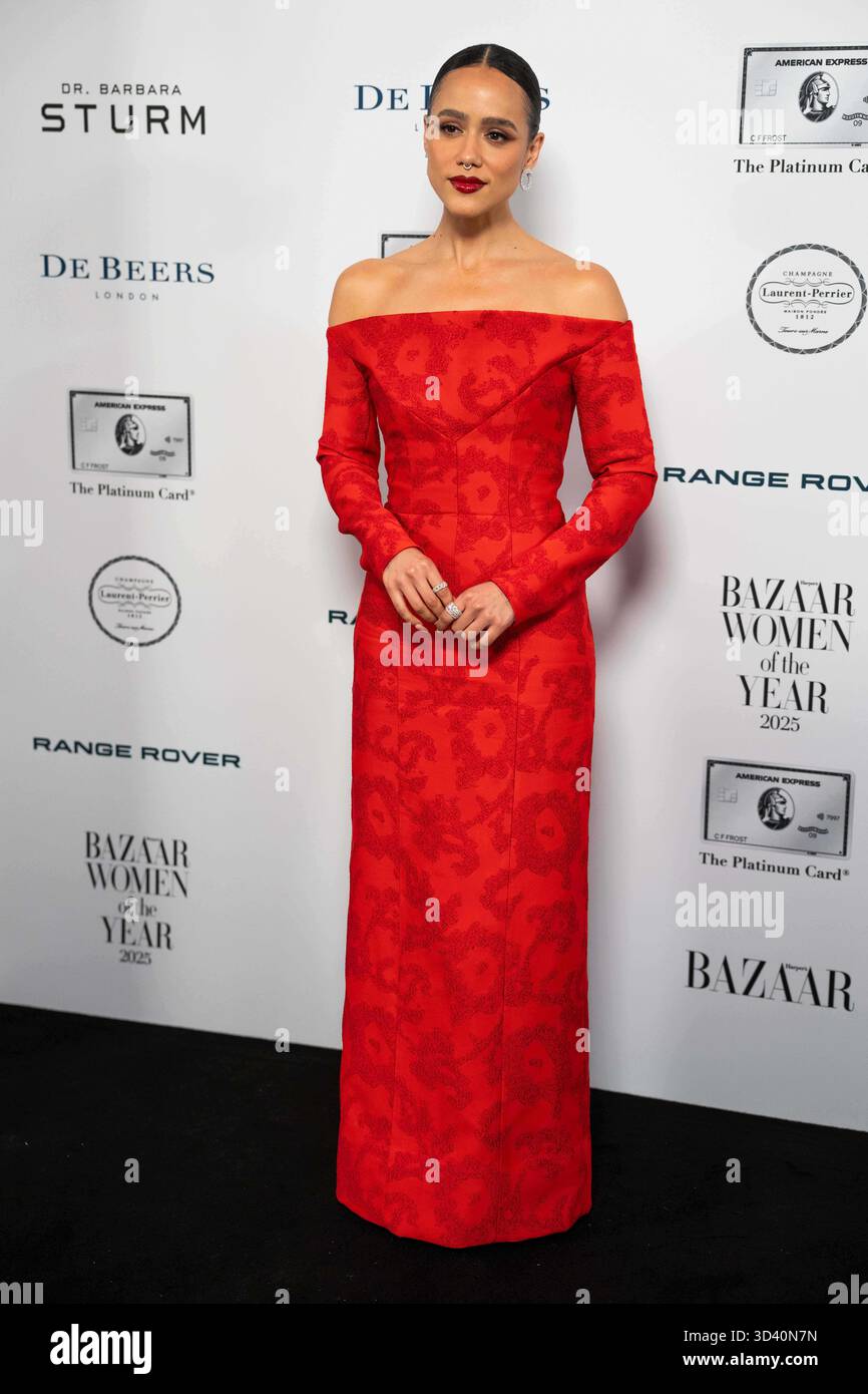 Nathalie Emmanuel poses for photographers upon arrival at the Harper's ...