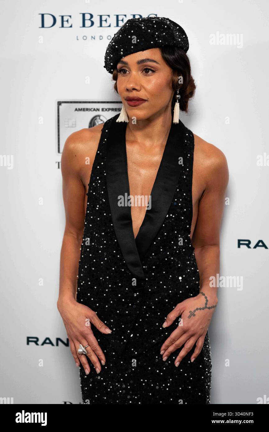 Alex Scott poses for photographers upon arrival at the Harper's Bazaar ...