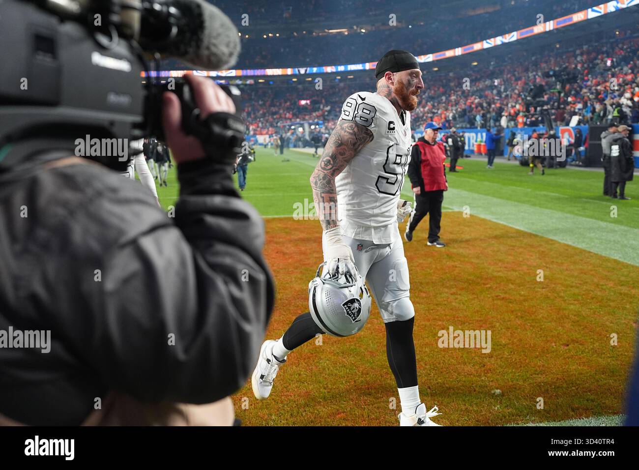 Las Vegas Raiders defensive end Maxx Crosby (98) heads off the field ...