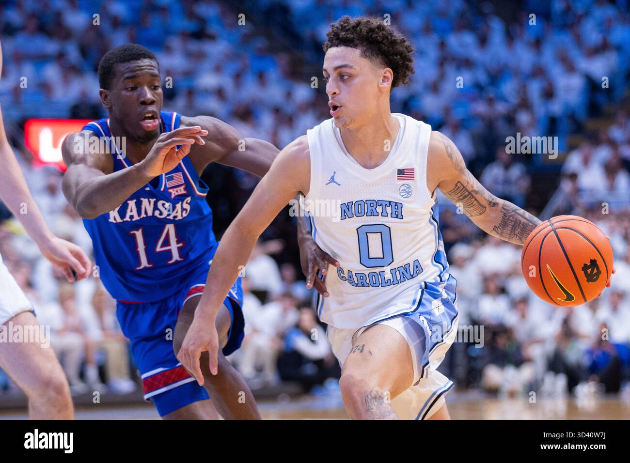 November 7, 2025: North Carolina Tar Heels guard Kyan Evans (0) drives ...