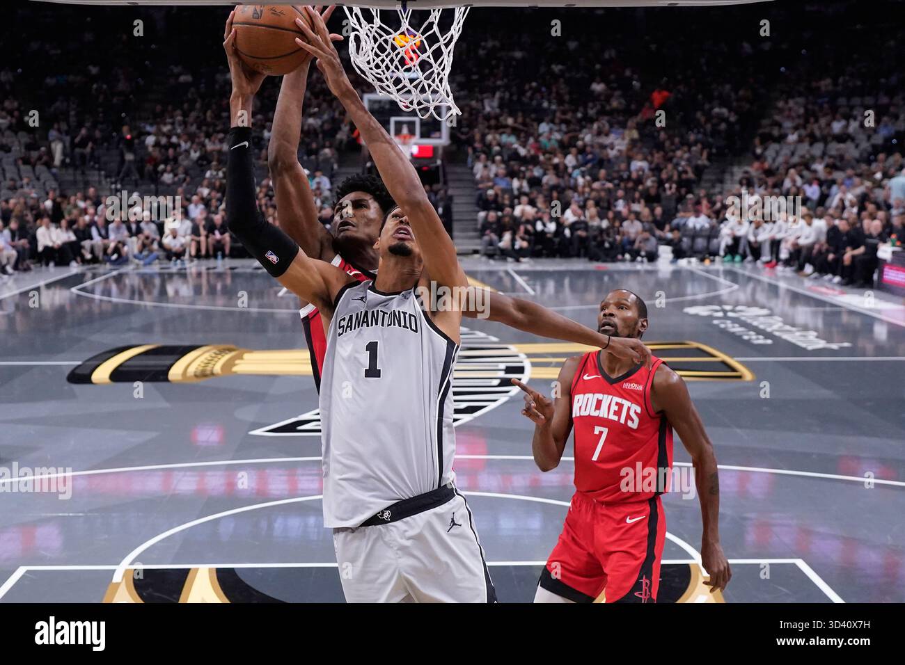 San Antonio Spurs forward Victor Wembanyama (1) scores past Houston ...