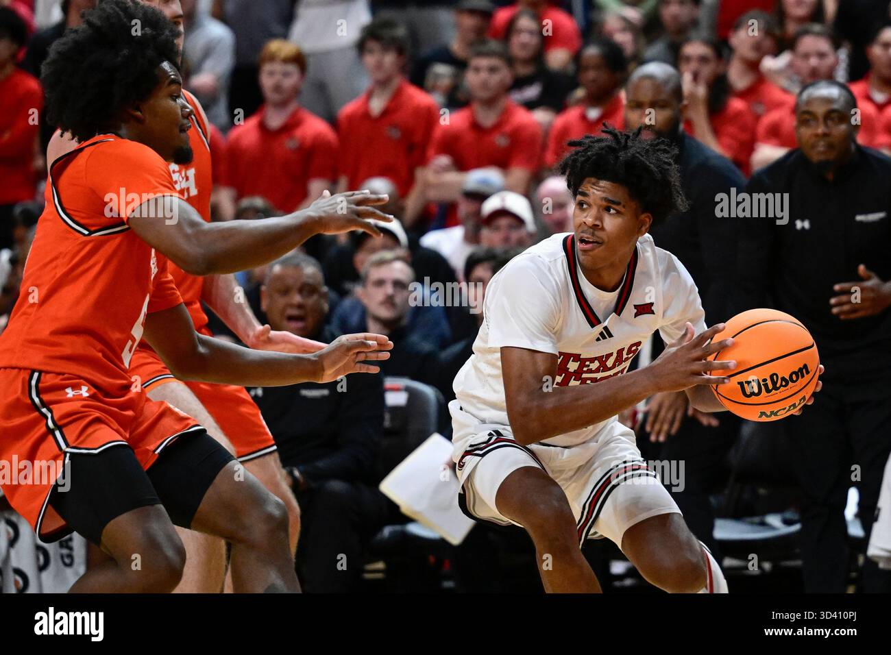 Texas Tech guard Christian Anderson, right, attempts to pass the ball ...