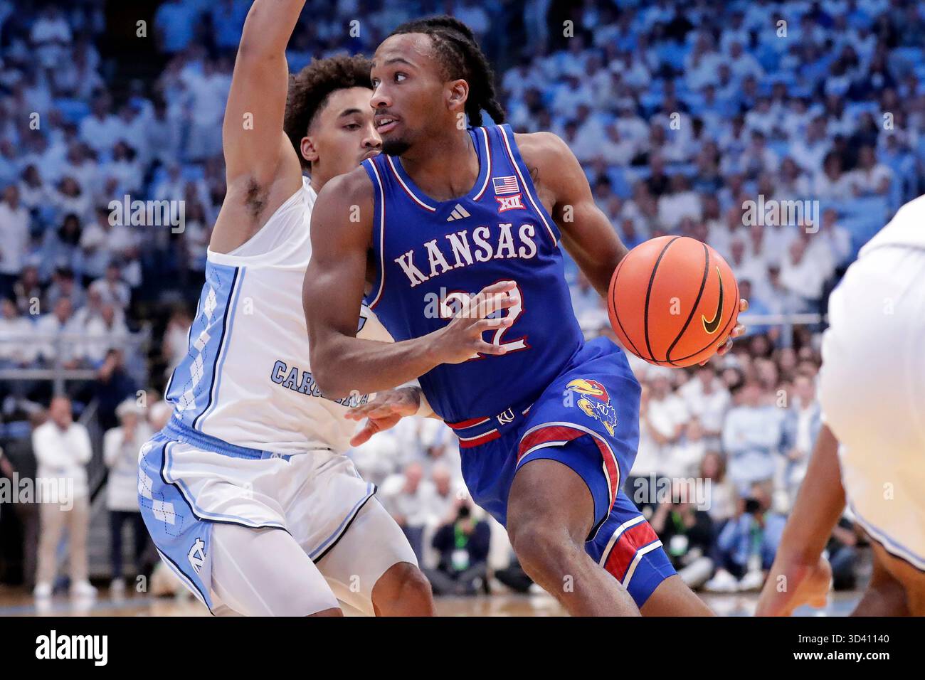 Kansas guard Darryn Peterson, right, drives against North Carolina ...