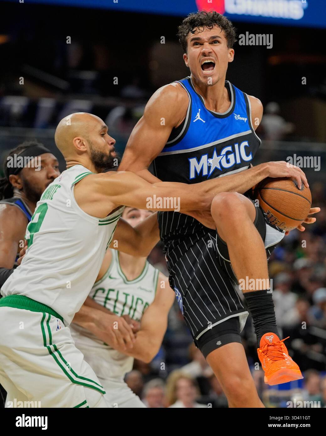 Boston Celtics guard Derrick White, left, blocks Orlando Magic forward ...