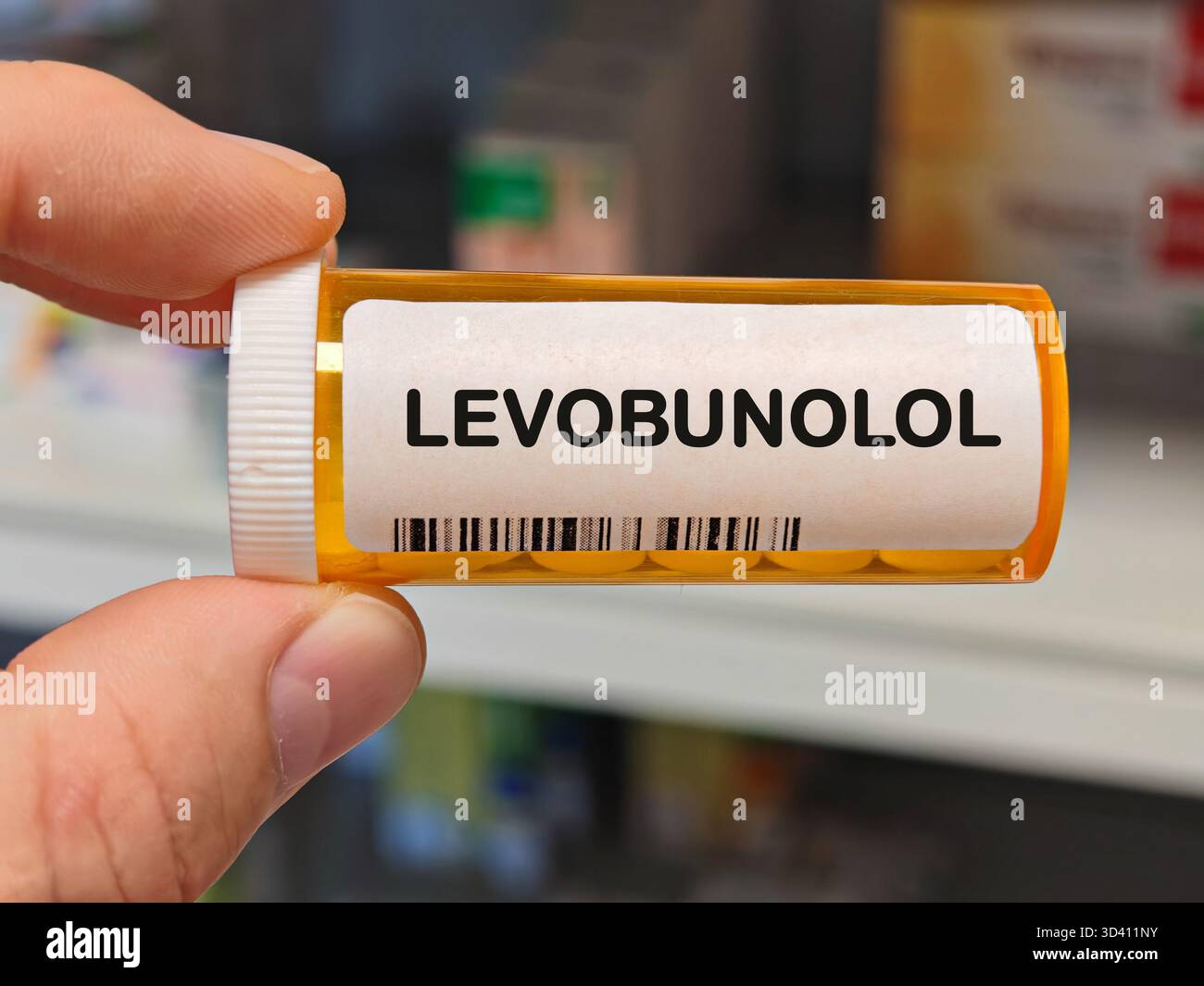 orange plastic Box of LEVOBUNOLOL tablets on a hospital pharmacy table ...