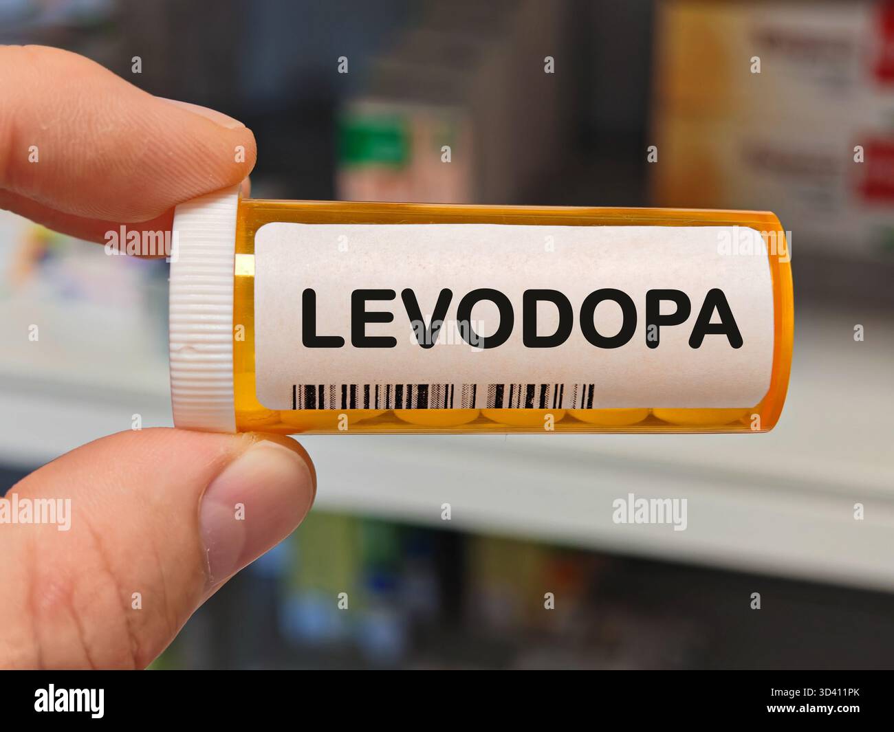 orange plastic Box of LEVODOPA tablets on a hospital pharmacy table ...
