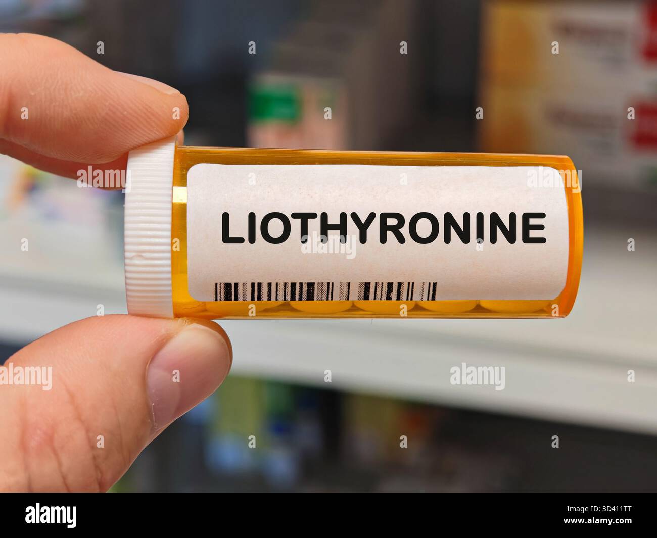 orange plastic Box of LIOTHYRONINE tablets on a hospital pharmacy table ...