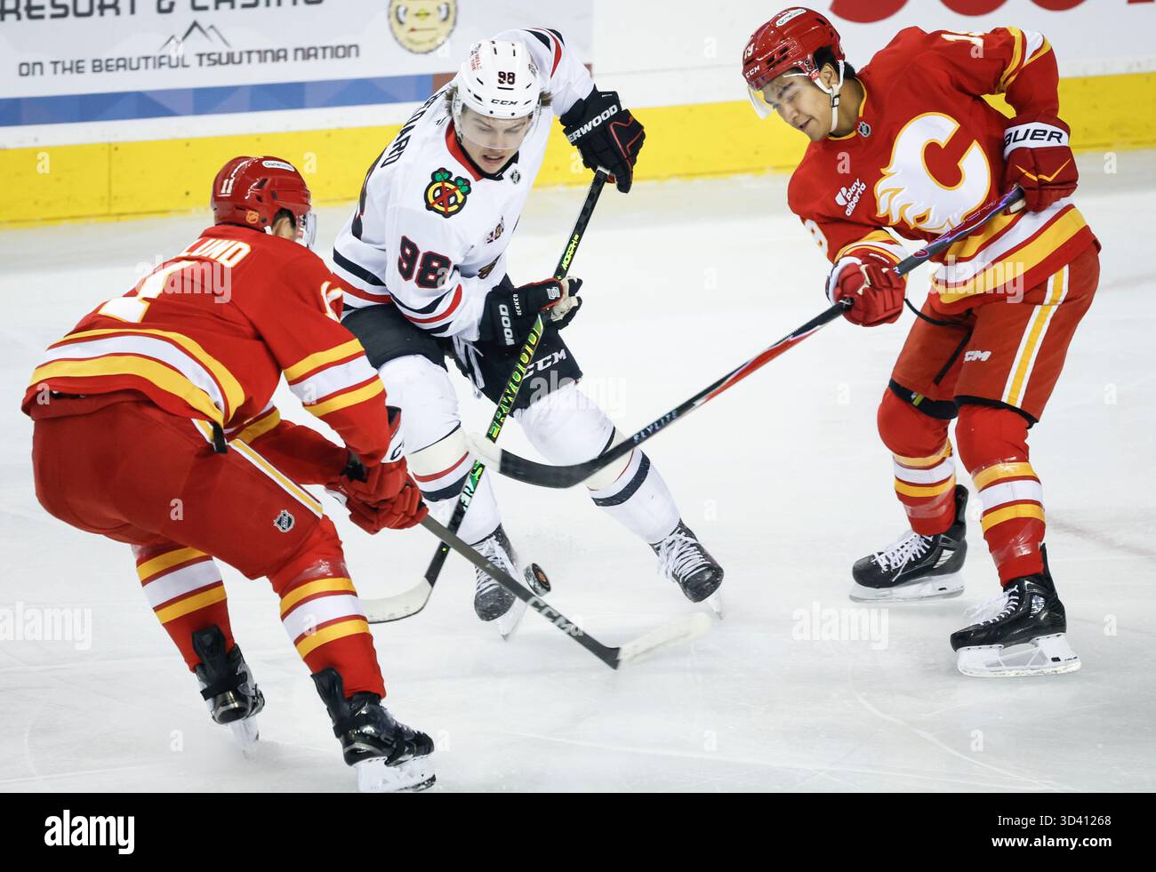 Chicago Blackhawks' Connor Bedard, centre, battles for the puck with ...