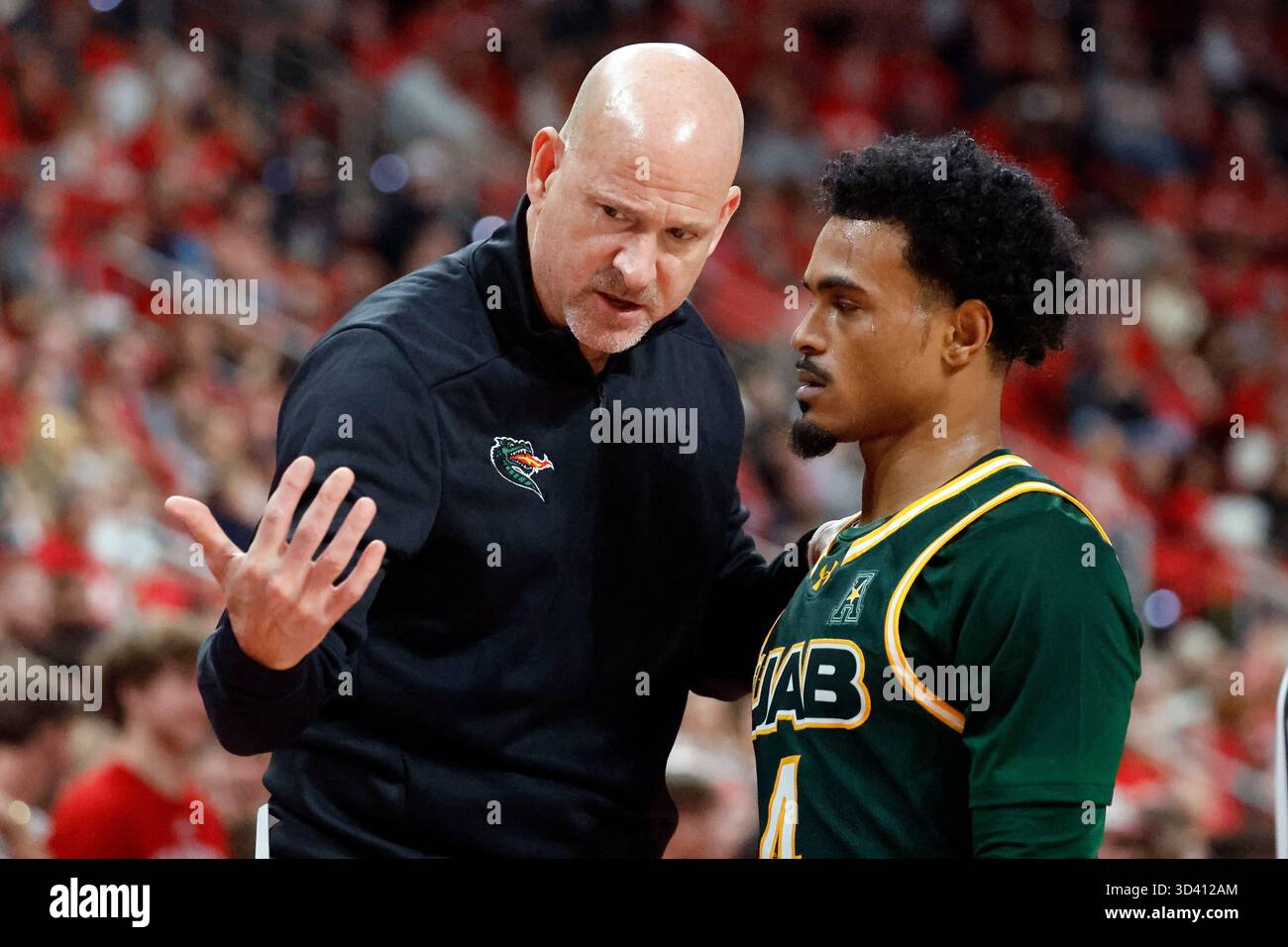 UAB head coach Andy Kennedy talks with guard Ahmad Robinson (4) during ...