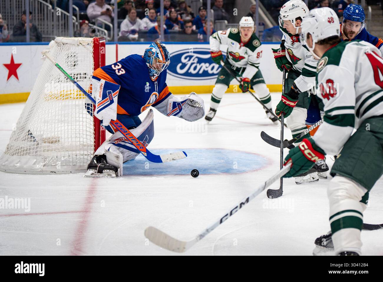 New York Islanders goaltender David Rittich (33) saves a snap shot by ...