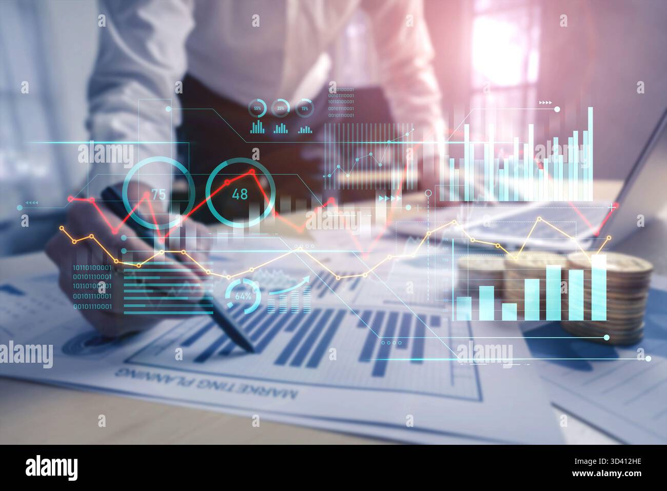 A business professional examines detailed financial data charts and ...
