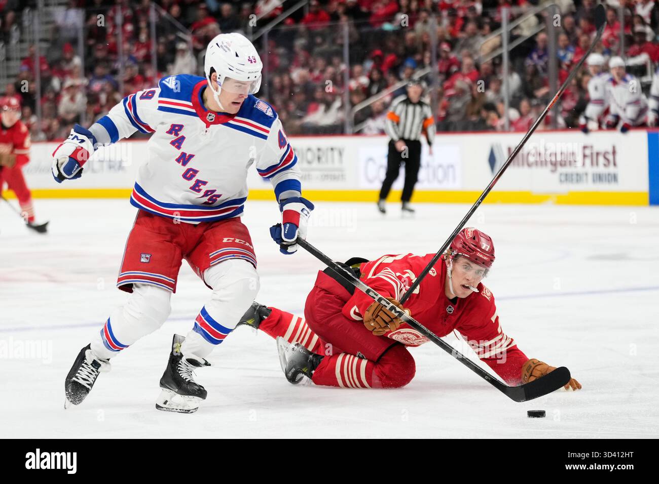 New York Rangers right wing Jaroslav Chmelar, left, moves the puck ...