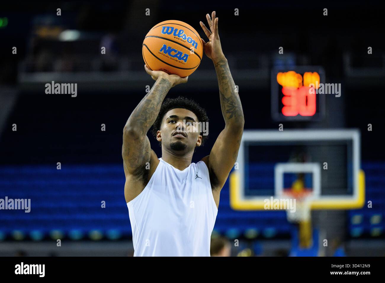 UCLA guard Donovan Dent warms up prior to an NCAA college basketball ...