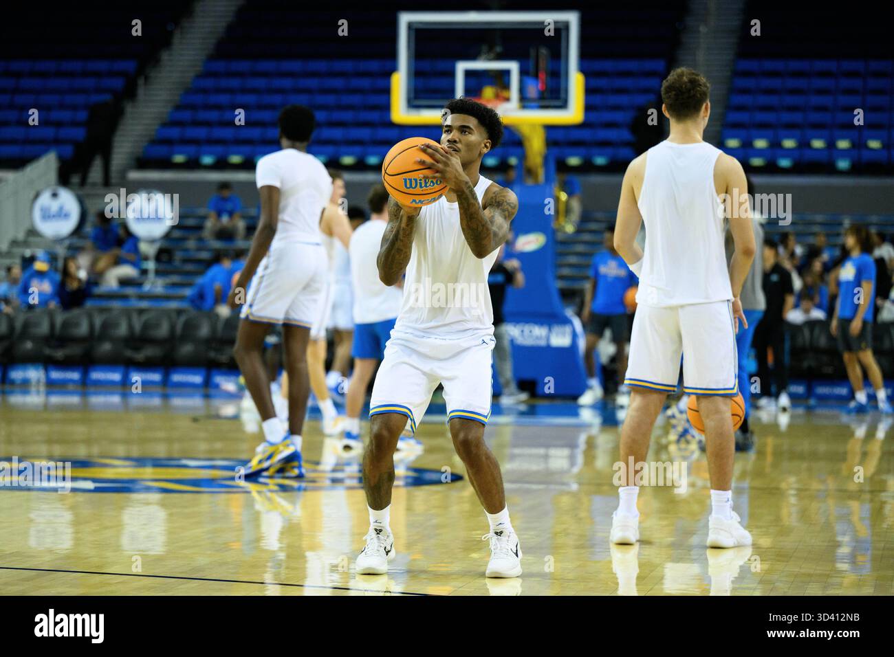 UCLA guard Donovan Dent warms up prior to an NCAA college basketball ...