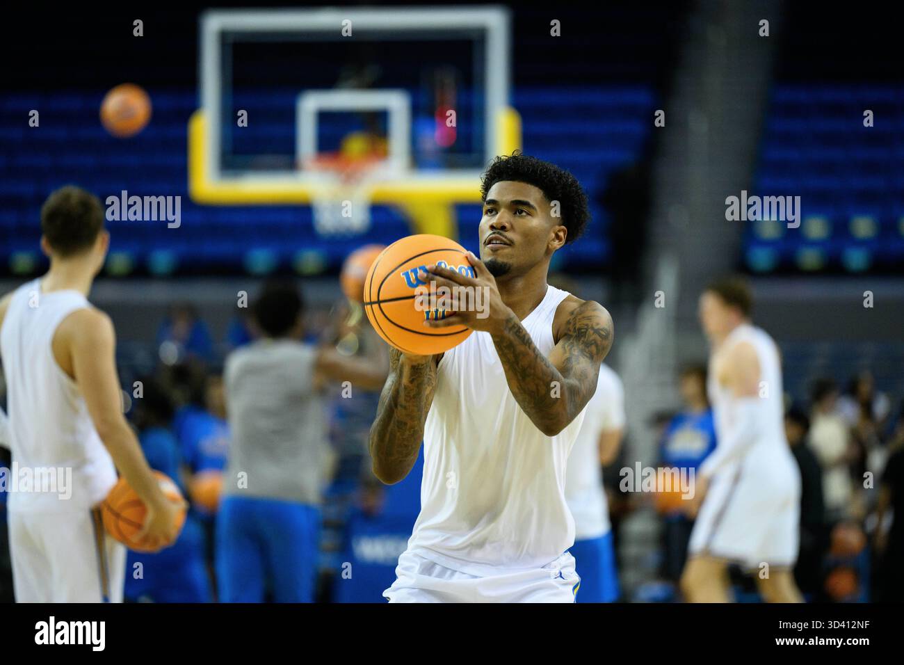 UCLA guard Donovan Dent warms up prior to an NCAA college basketball ...