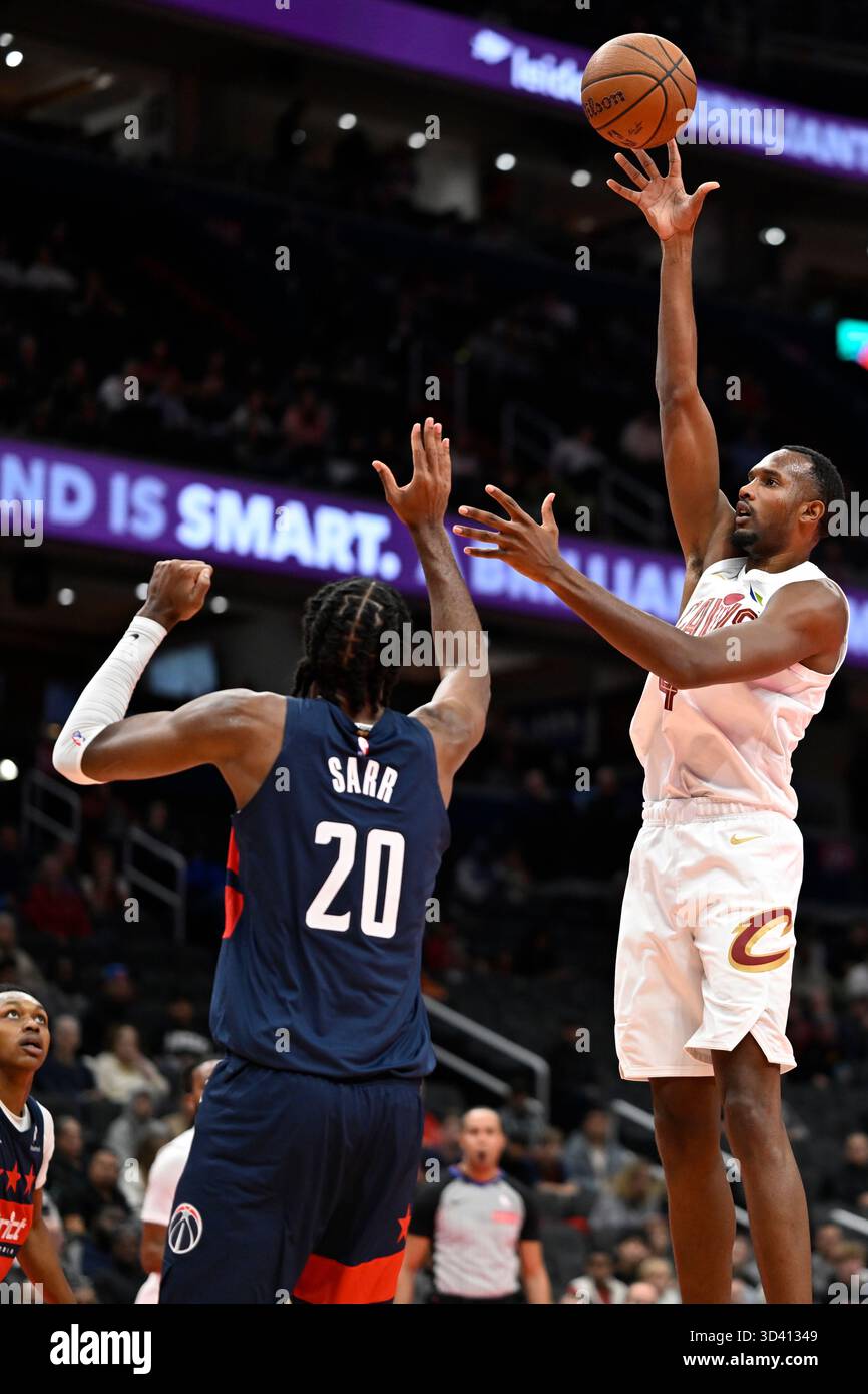 Cleveland Cavaliers center Evan Mobley, right, scores a basket over ...
