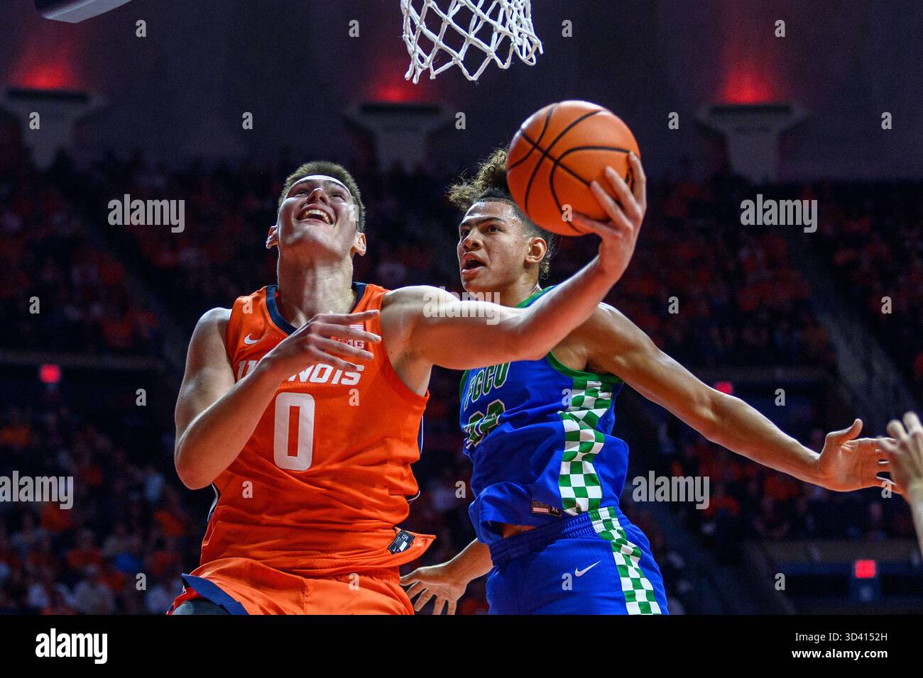 Illinois' David Mirkovic drives to the basketball past Florida Gulf Coast's Isaiah Malone during ...