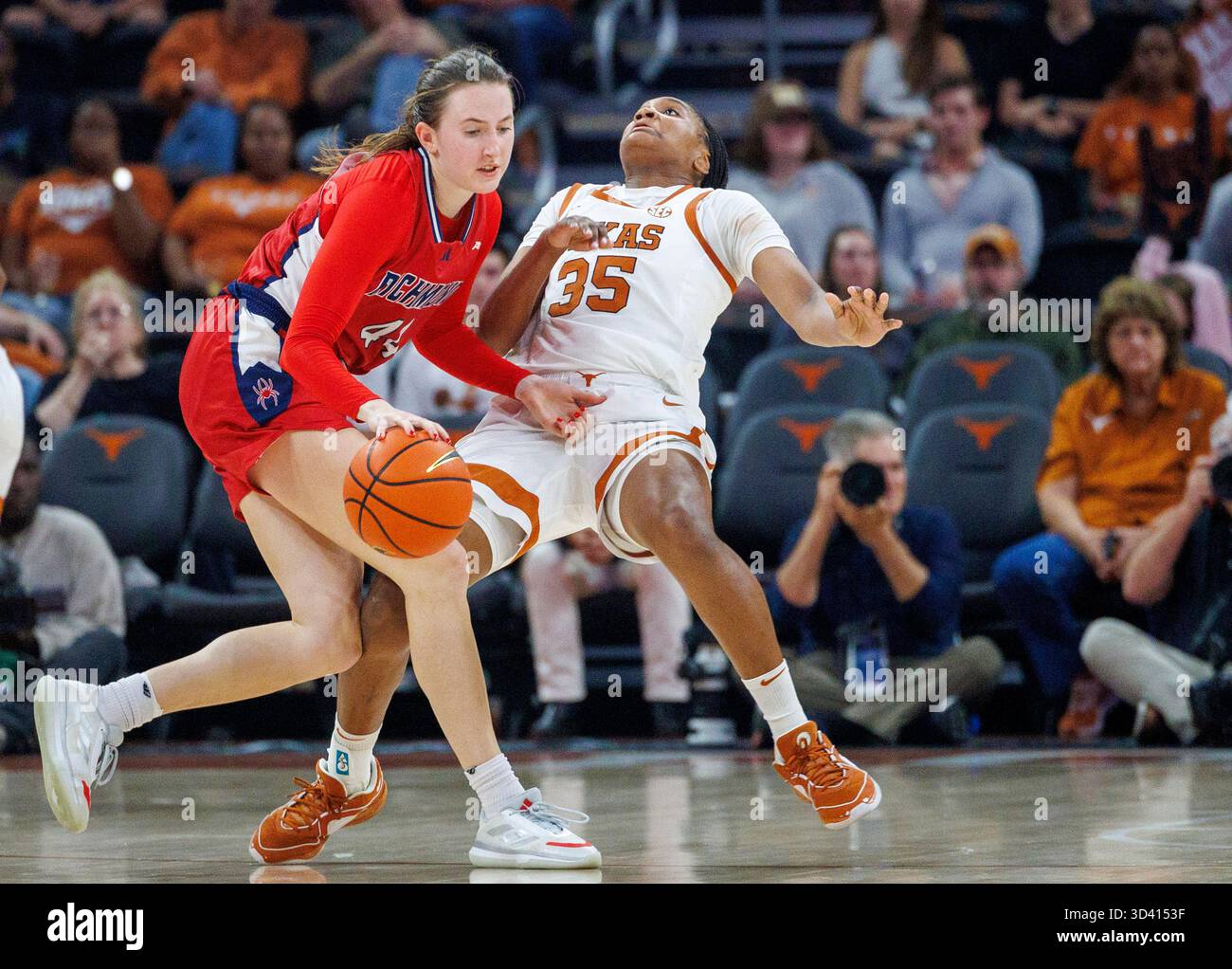 Richmond forward Maggie Doogan runs into Texas forward Madison Booker ...