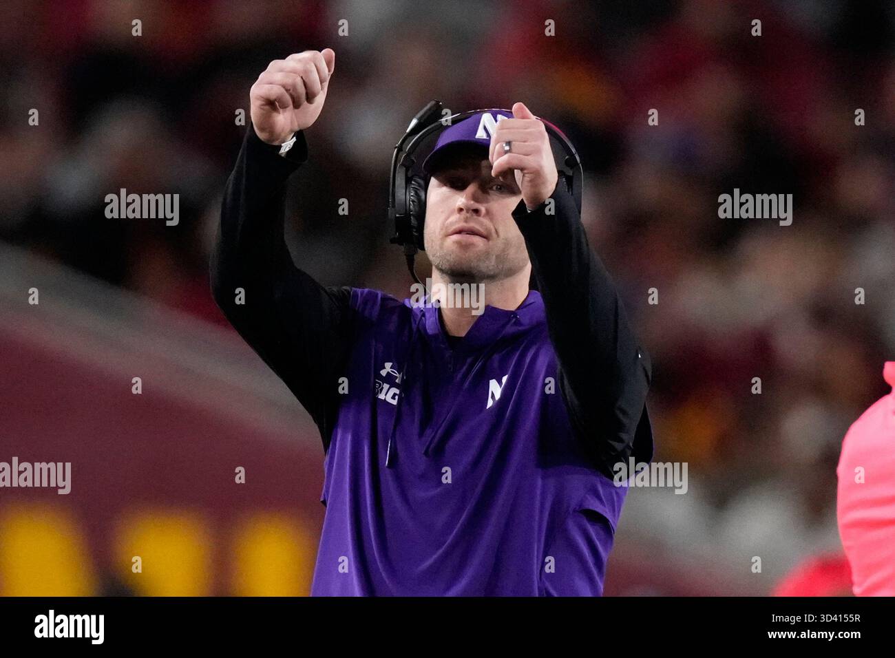 Northwestern head coach David Braun gestures during the first half of ...