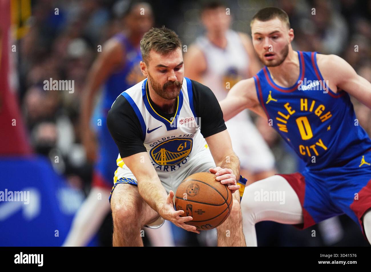 Golden State Warriors guard Pat Spencer, left, recovers the ball as ...