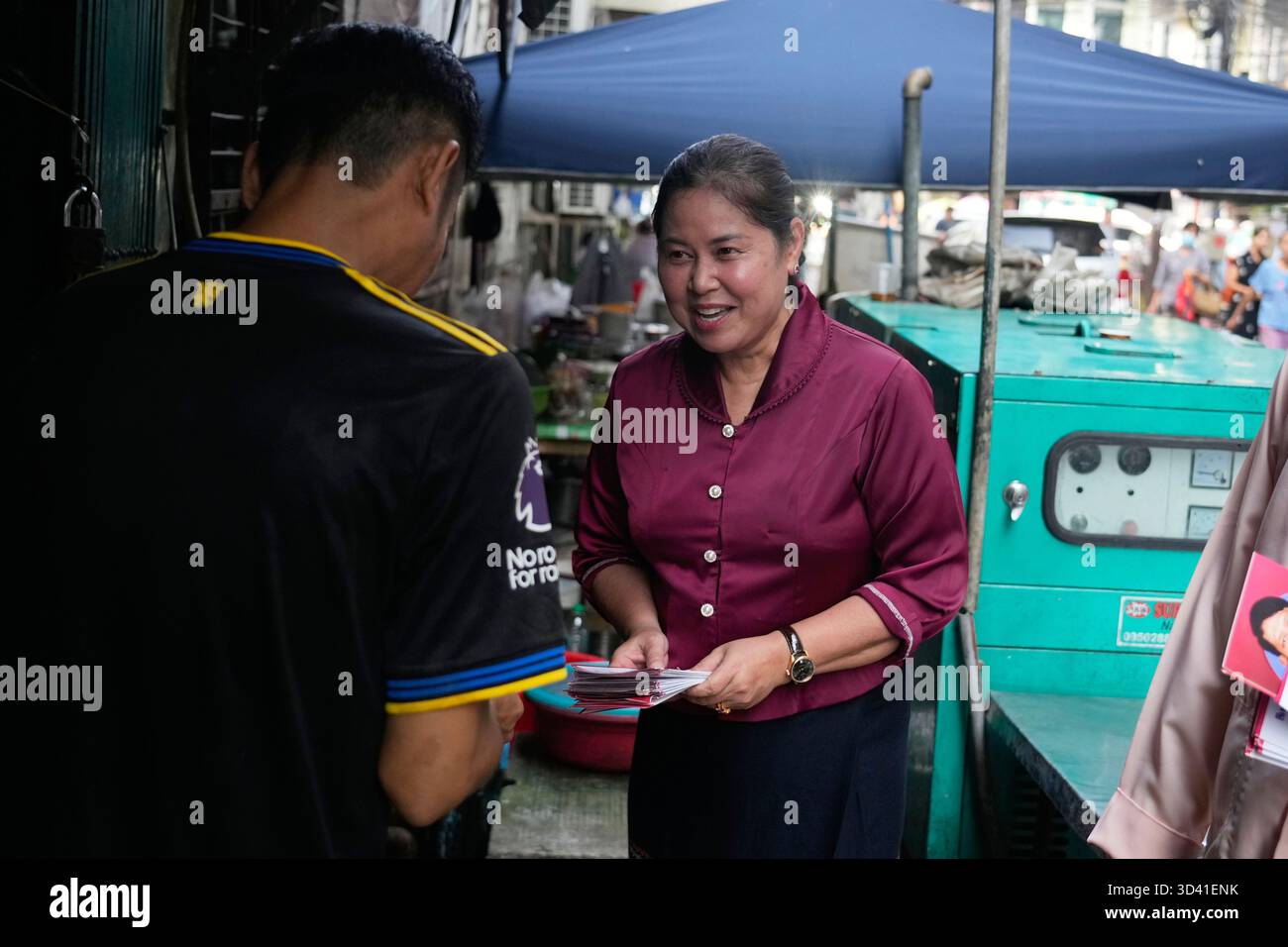 Sandar Min, right, an individual candidate for upcoming election and ...