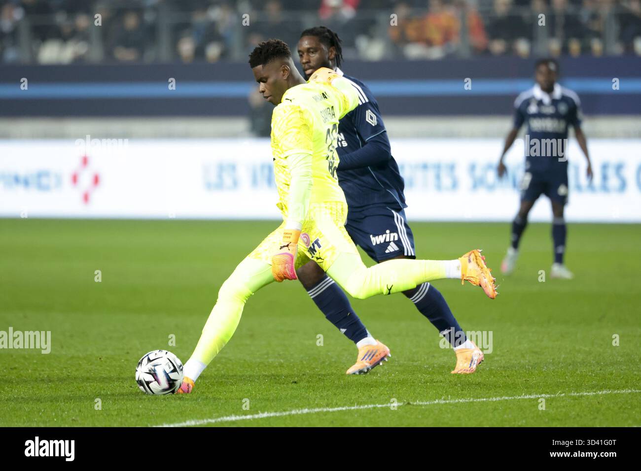 Rennes goalkeeper Brice Samba, Jean-Philippe Krasso of Paris FC during ...