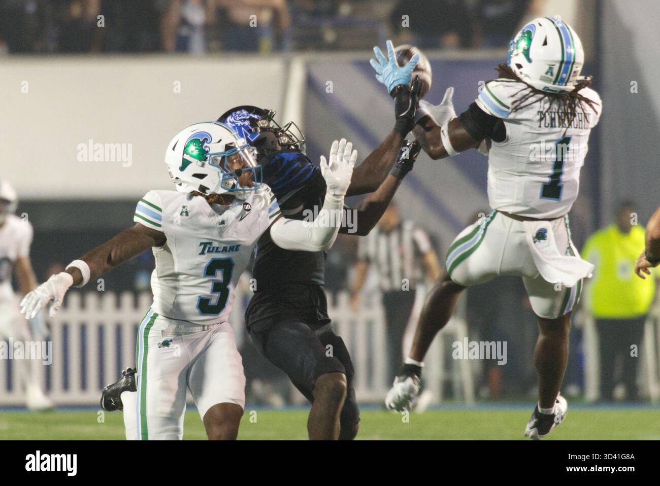 Tulane safety Jack Tchienchou (1) grabs an interception intended by ...