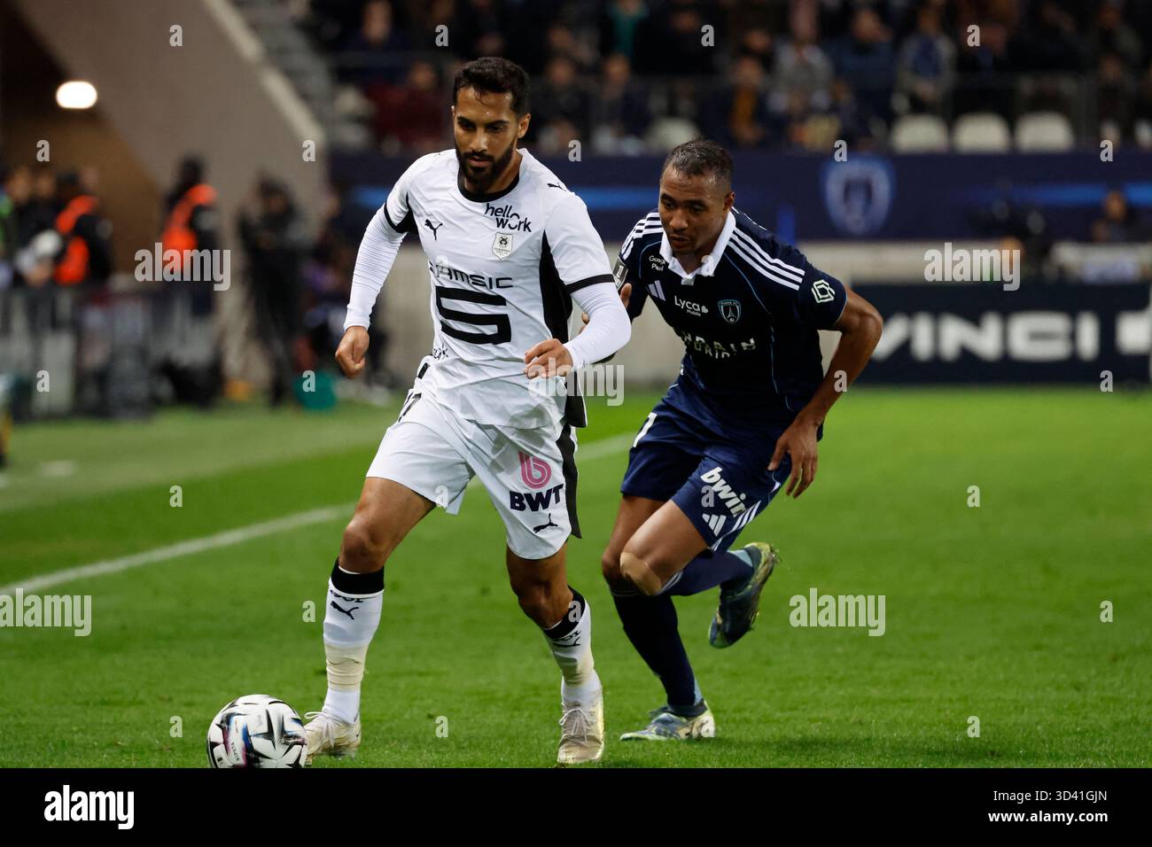 PFC’s Samir Chergui battles Rennes’s Musa Al-Taamari during the 2025-26 ...