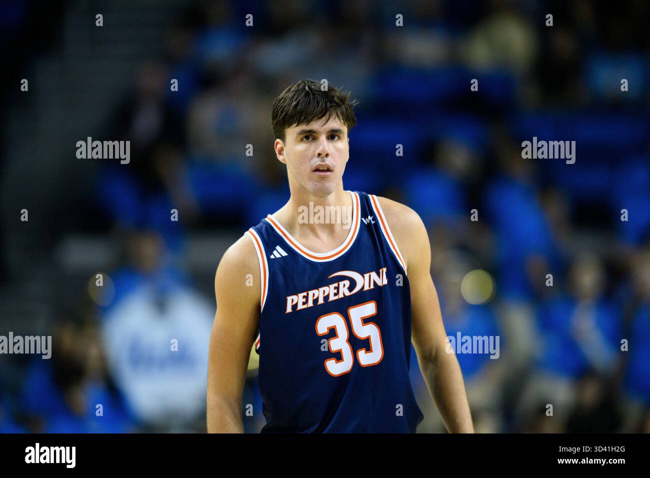 Pepperdine forward Danilo Dozic looks on during the first half of an ...