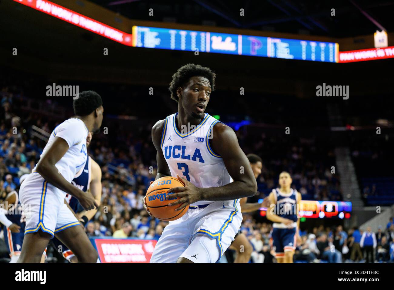 UCLA forward Eric Dailey Jr. (3) makes a rebound during the first half ...