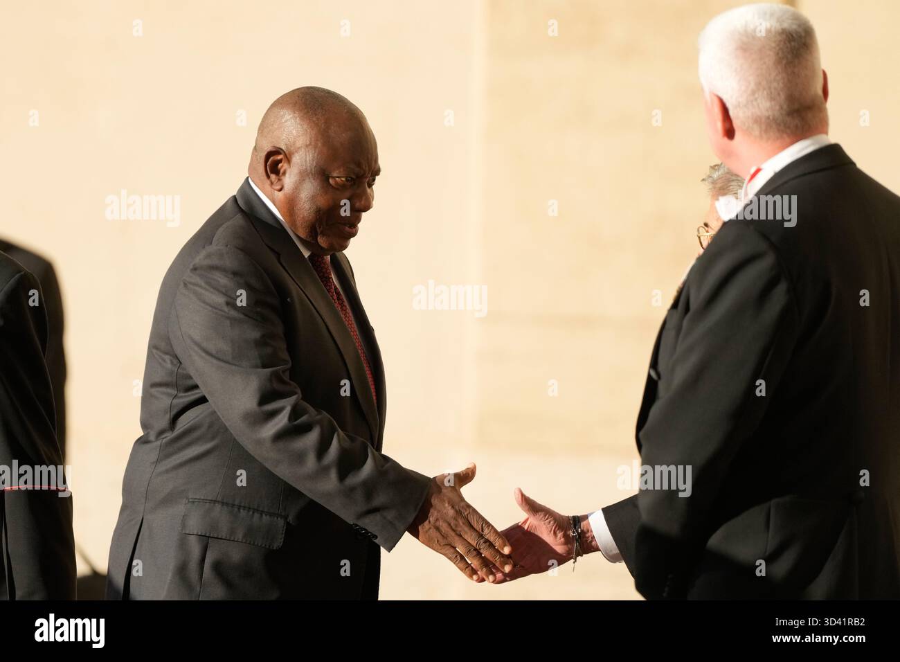 President of South Africa Cyril Ramaphosa, left, greets Vatican ...