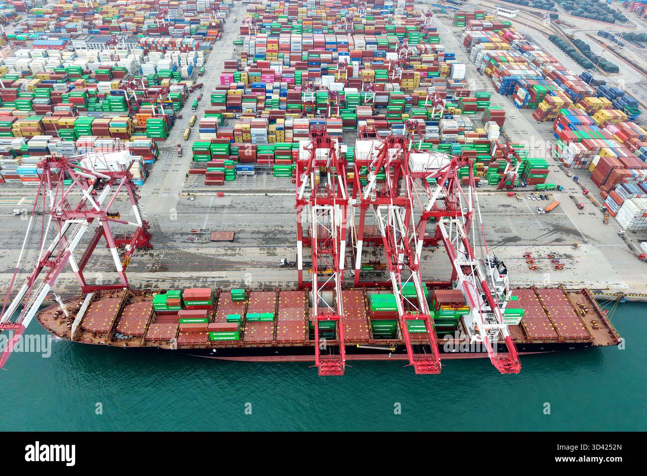 QINGDAO, CHINA - NOVEMBER 8, 2025 - A cargo ship is loading and ...