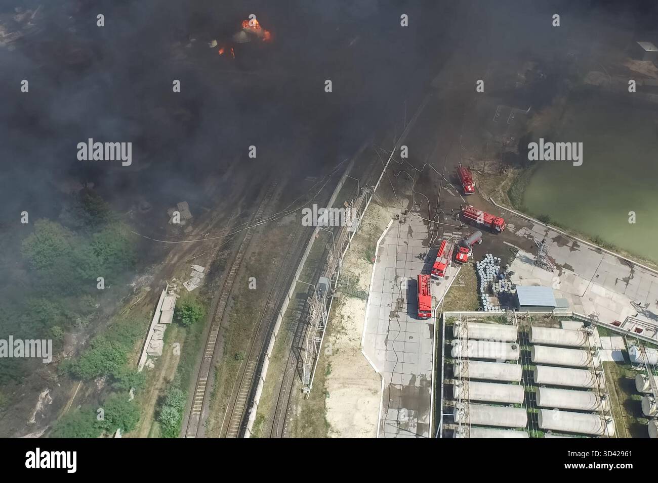 Oil storage fire. The tank farm is burning, black smoke is the ...
