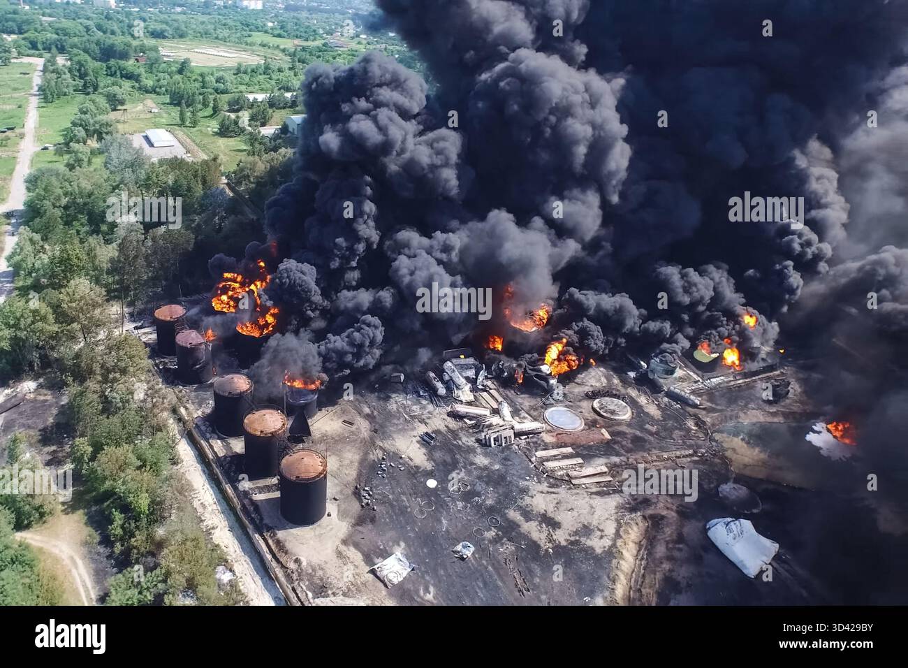 Oil storage fire. The tank farm is burning, black smoke is the ...