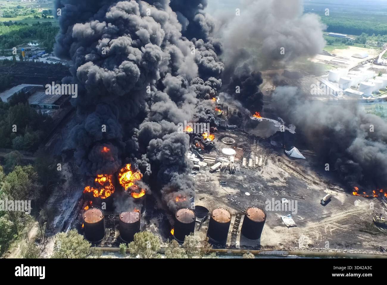 Oil storage fire. The tank farm is burning, black smoke is the ...