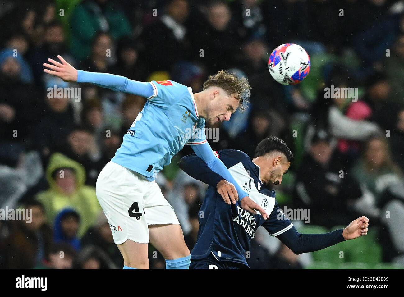 Liam Bonetig of Melbourne City (left) headers the ball during the A ...