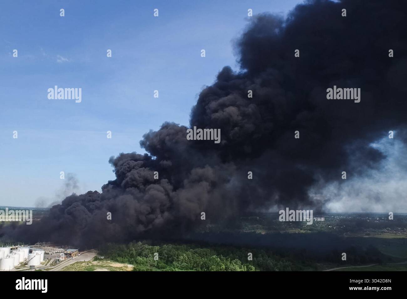 Oil storage fire. The tank farm is burning, black smoke is the ...