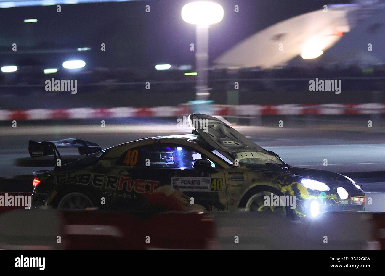 Correction: A car drives while a bonnet remaining open on the course of ...