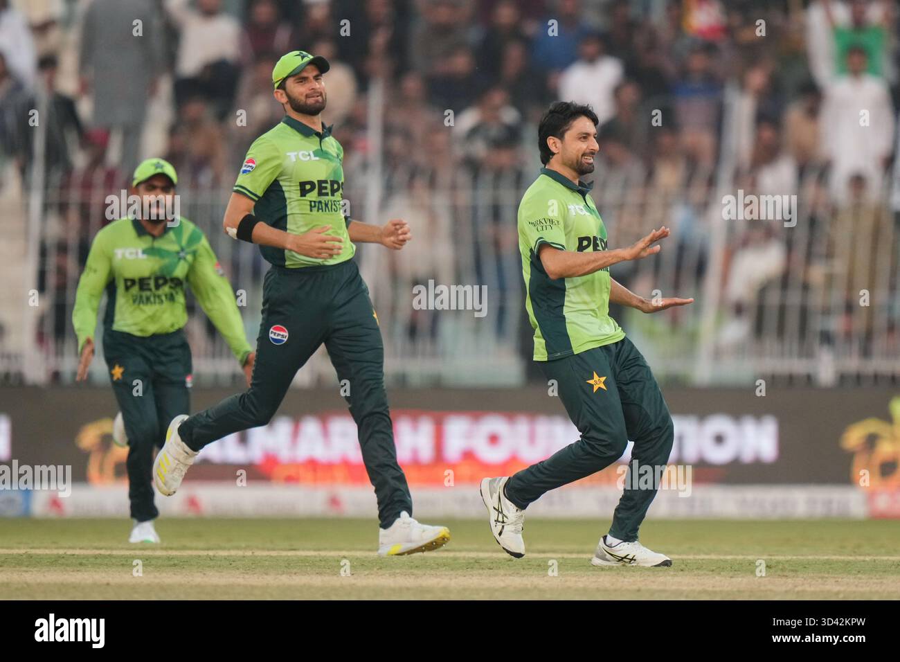 Pakistan's Abrar Ahmed, right, and teammates celebrate after the ...