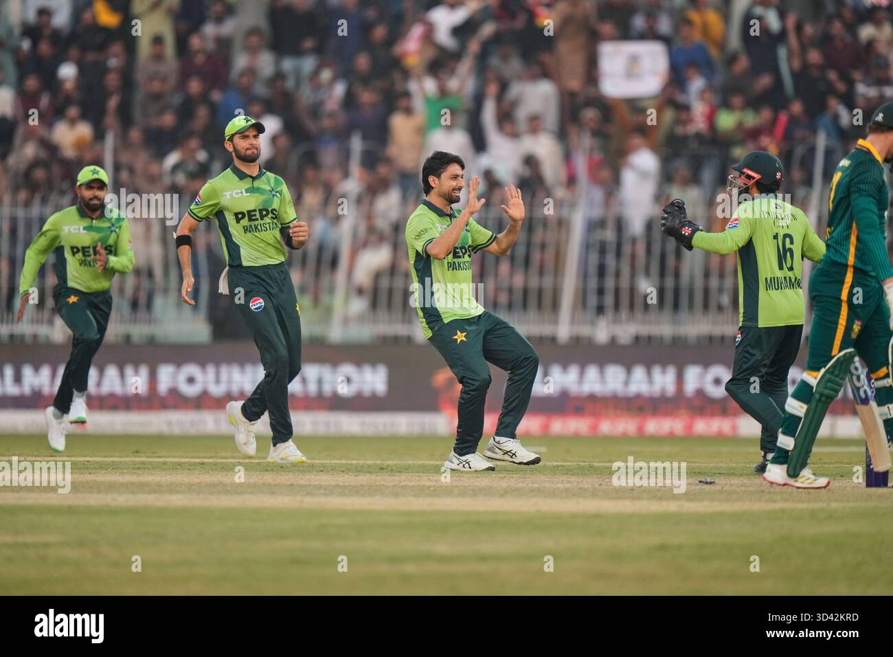 Pakistan's Abrar Ahmed, center, and teammates celebrate after the ...