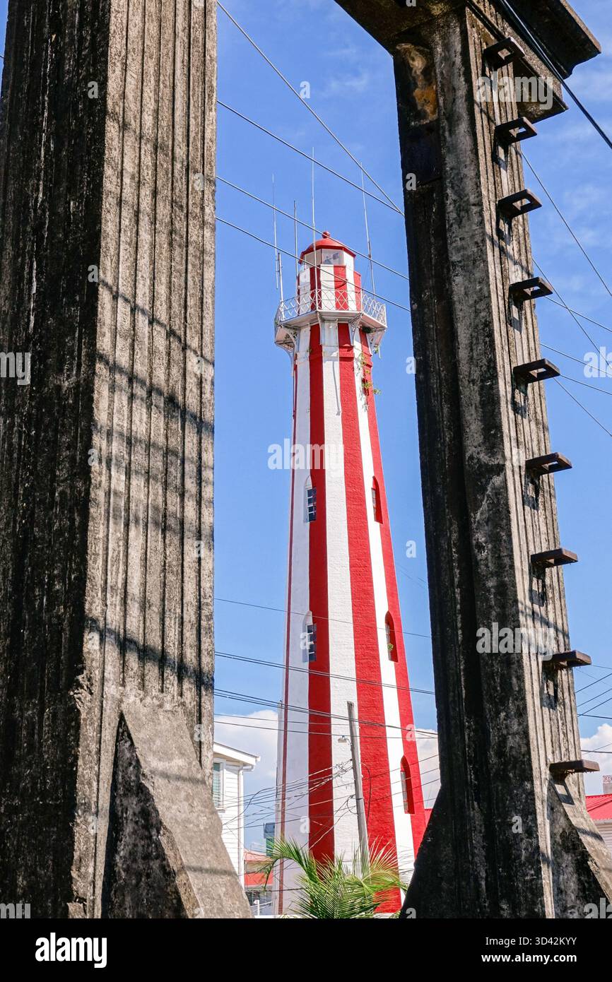 The candy striped Georgetown Lighthouse framed by an ancient kokers or ...
