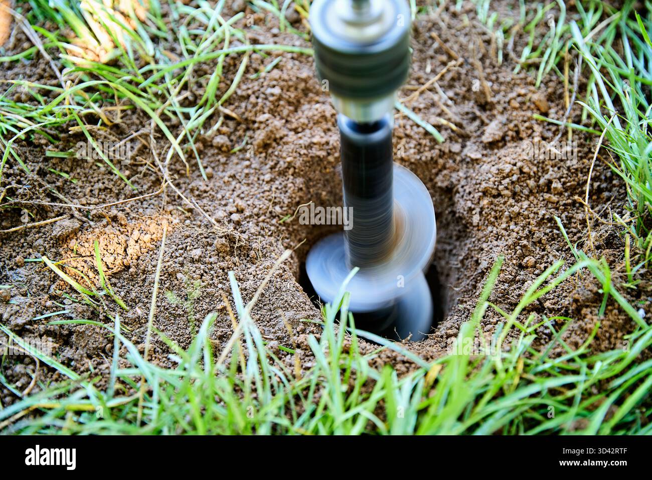 Digging hole with an auger hi-res stock photography and images - Alamy