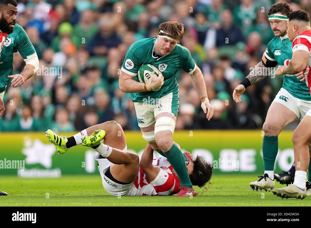Ireland's Ryan Baird is tackled by Japan's Kenji Sato during the ...